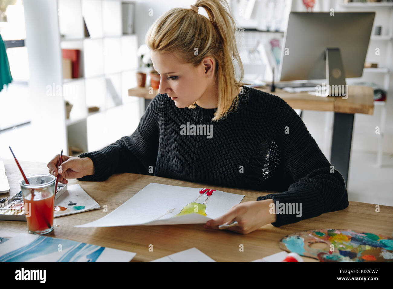 Fashion designer drawing sketch Stock Photo - Alamy