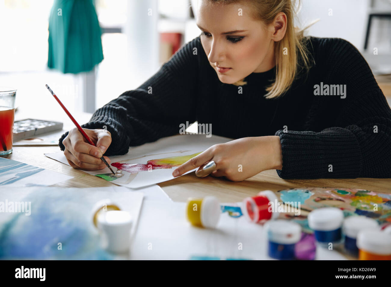 Fashion designer drawing sketch Stock Photo - Alamy