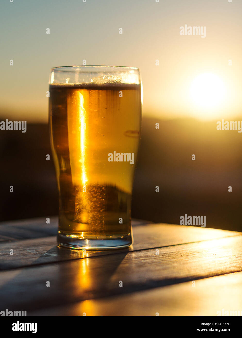 Glass of beer on the sunset Stock Photo - Alamy