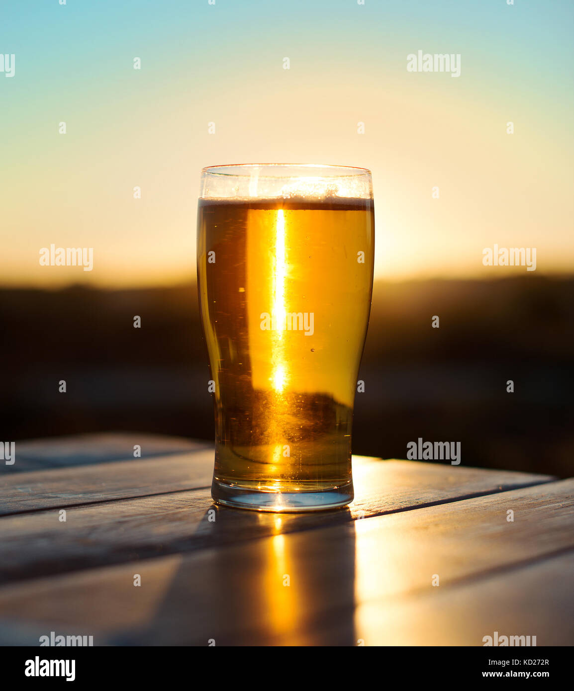 Glass of beer on the sunset Stock Photo - Alamy