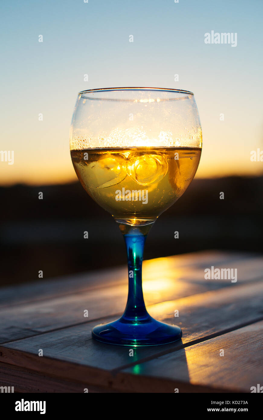 Cooled white wine on the sunset Stock Photo - Alamy