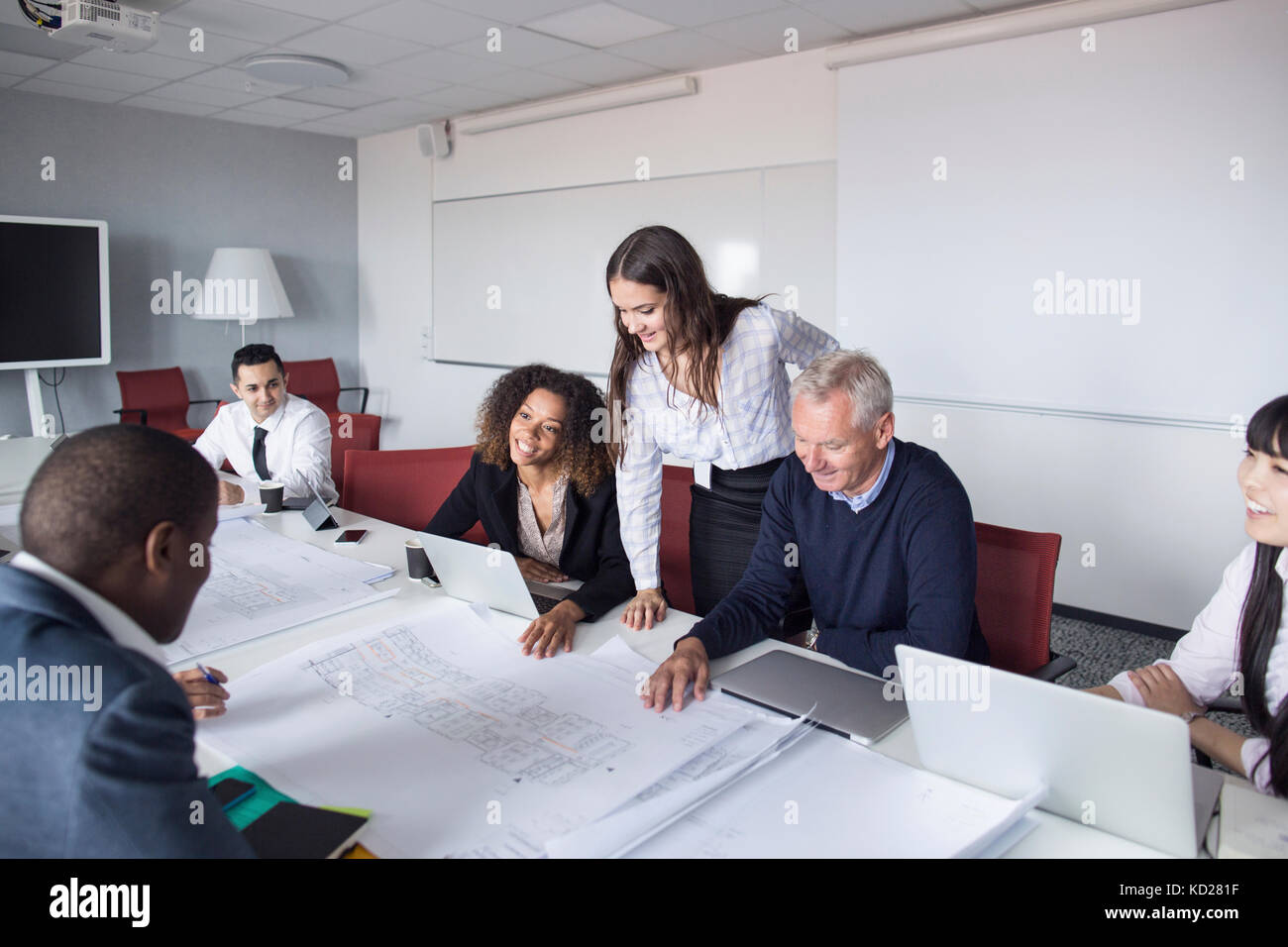 Team of architects and project managers working in office Stock Photo ...