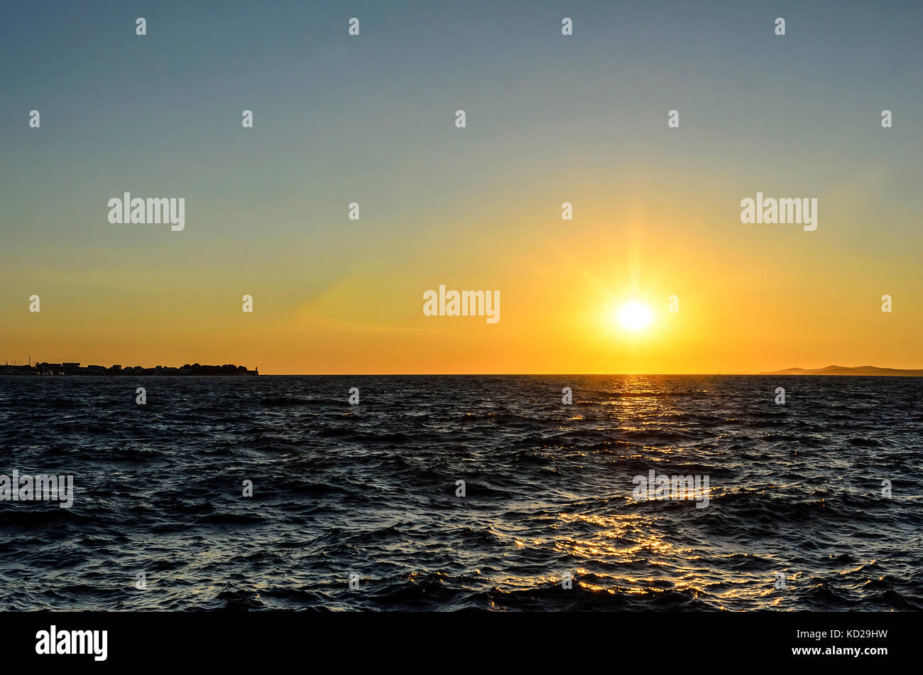 Sunset at the sea Stock Photo - Alamy