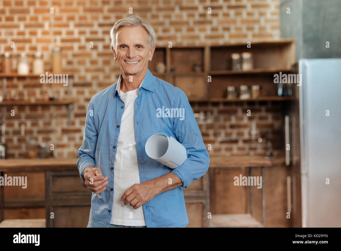 Cheerful male employee holding hi-res stock photography and images - Alamy