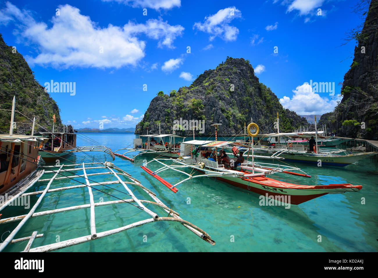 Coron, Philippines - Apr 9, 2017. Wooden boats docking at jetty in ...
