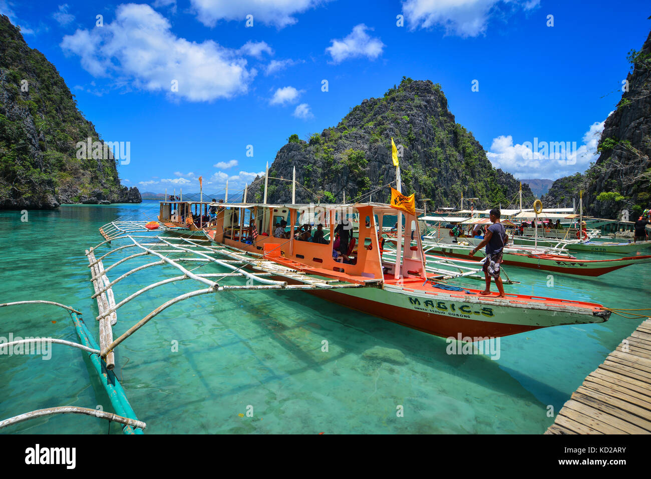 Coron, Philippines - Apr 9, 2017. Wooden boats waiting at jetty in ...