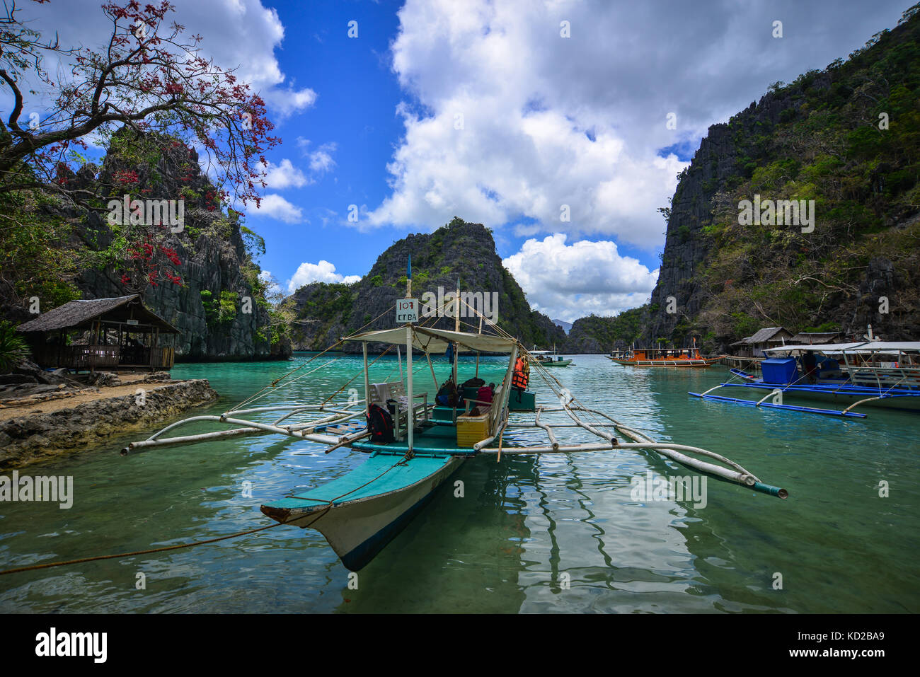 Coron, Philippines - Apr 9, 2017. Wooden boats docking at pier in Coron ...
