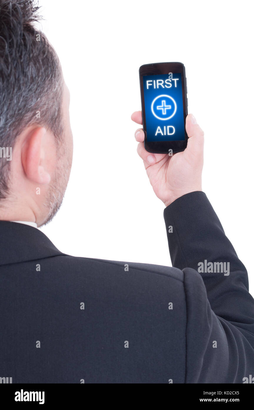 Male holding smartphone with first aid text as medical emergency ...