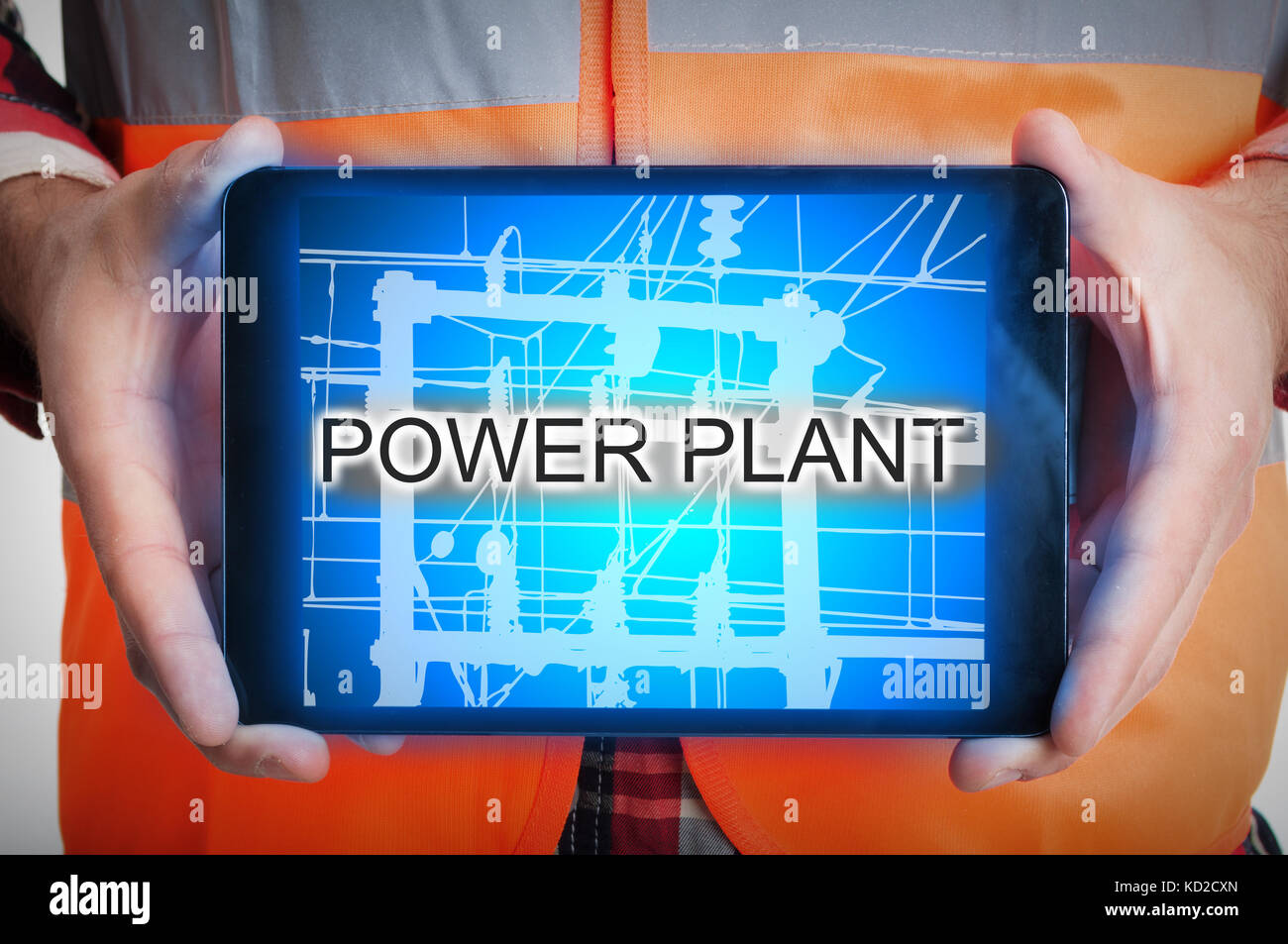 Male electrician holding tablet with power plant in closeup as modern ...
