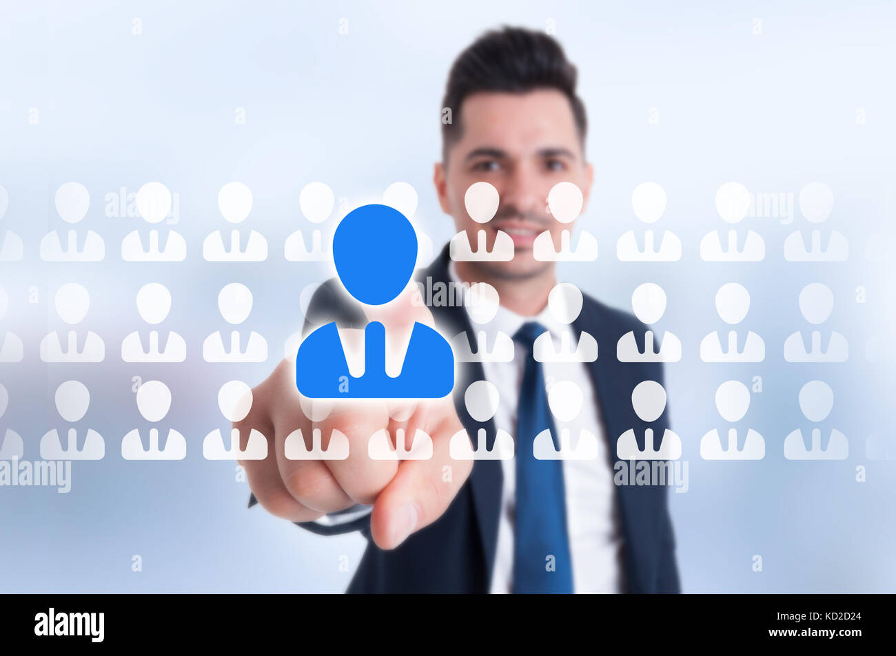 Handsome manager pointing on transparent icon with contact symbol for ...