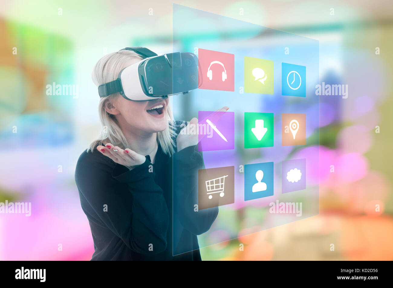 Beautiful woman wearing futuristic glasses and looking at virtual ...