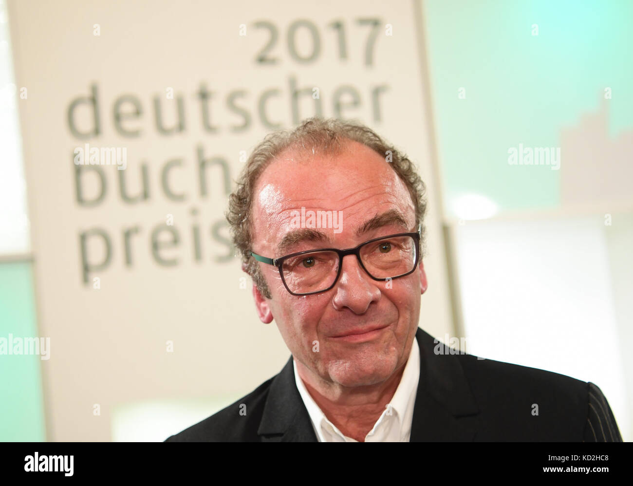 Austrian author Robert Menasse looks emotional after being awarded the ...