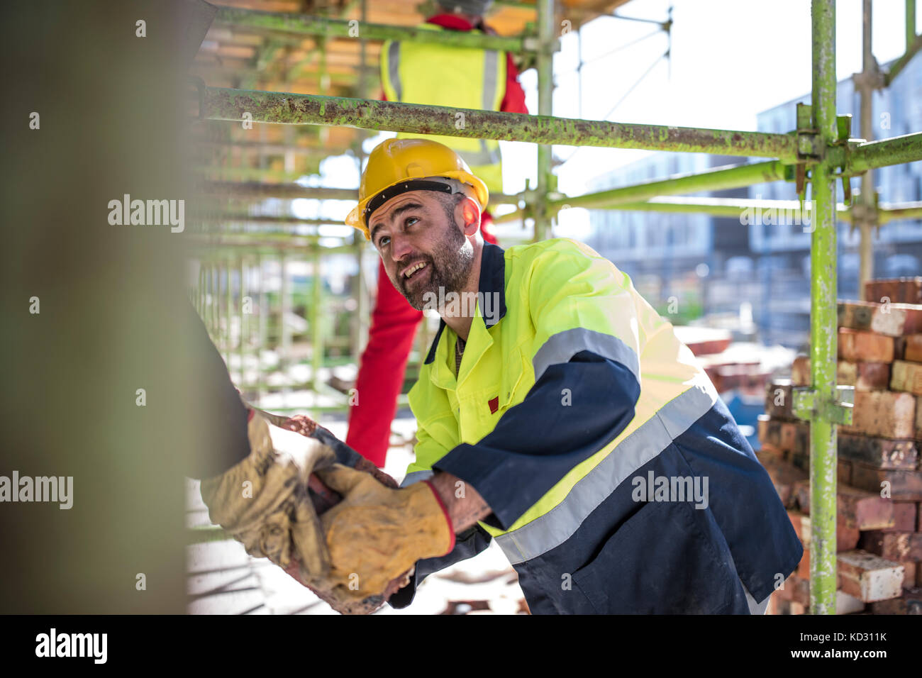 Lifting bricks hi-res stock photography and images - Alamy