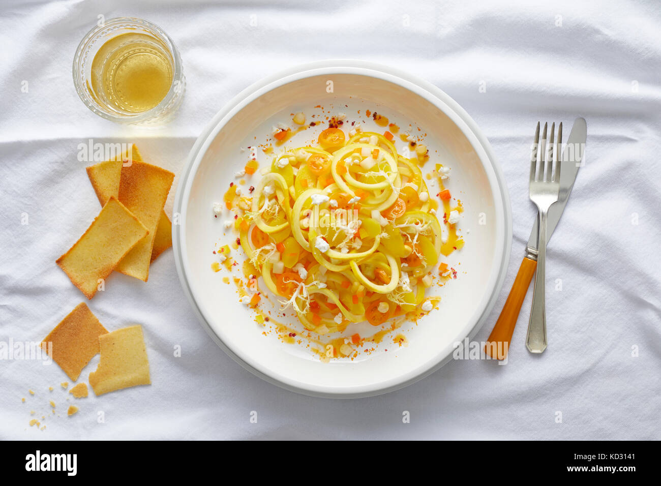 Spiralized yellow squash pasta with yellow cherry tomato, feta, orange ...