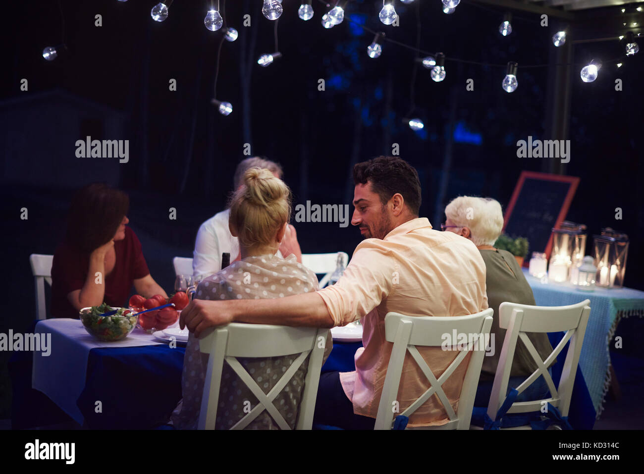 Group people sitting around table hi-res stock photography and images ...