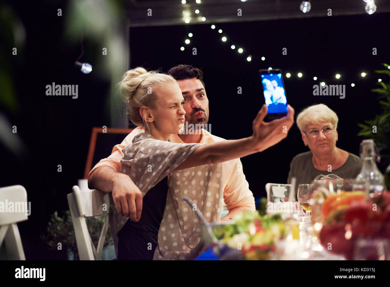 Group people sitting around table hi-res stock photography and images ...