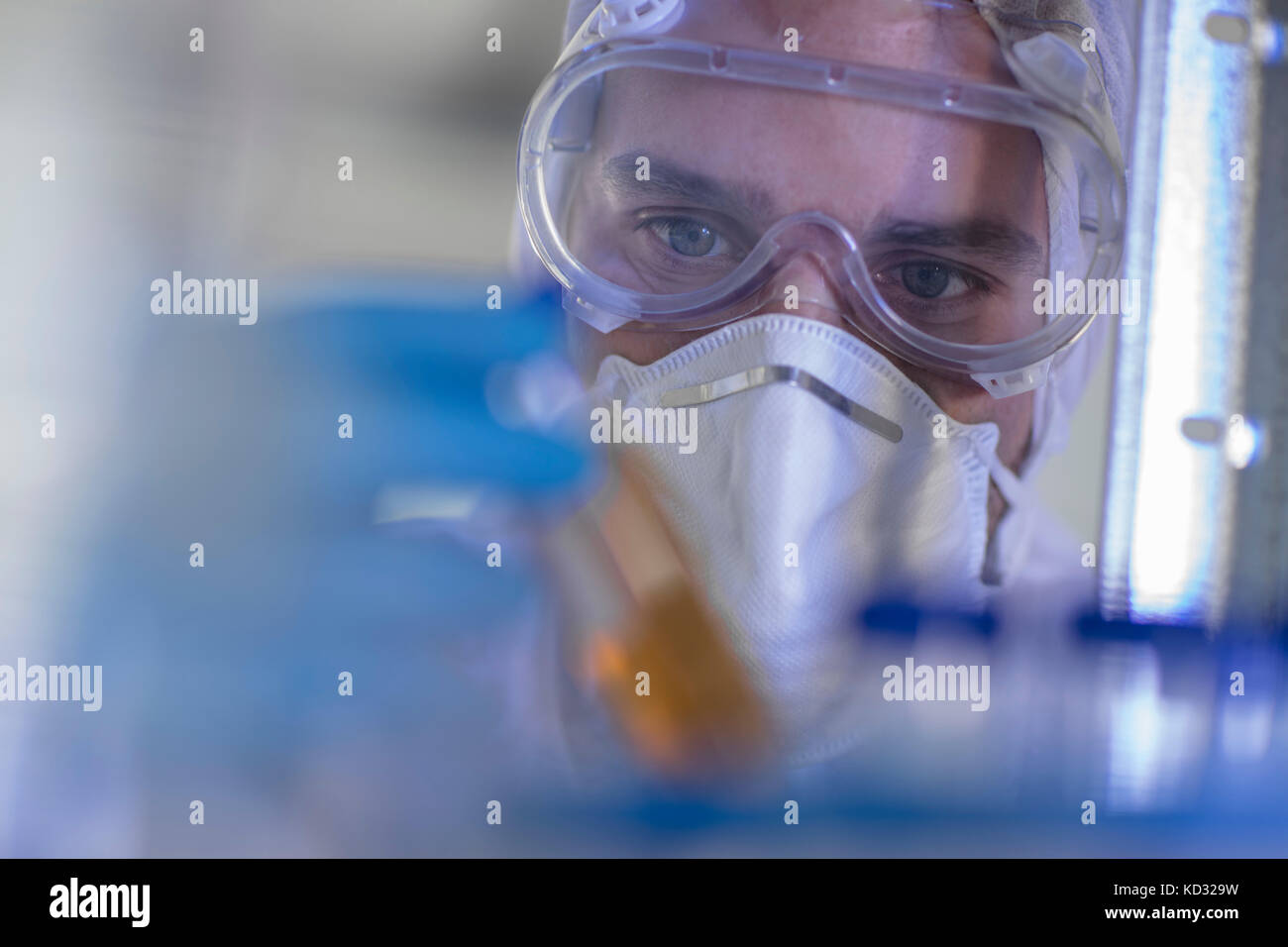 Laboratory worker holding liquid filled test tube, close-up Stock Photo ...