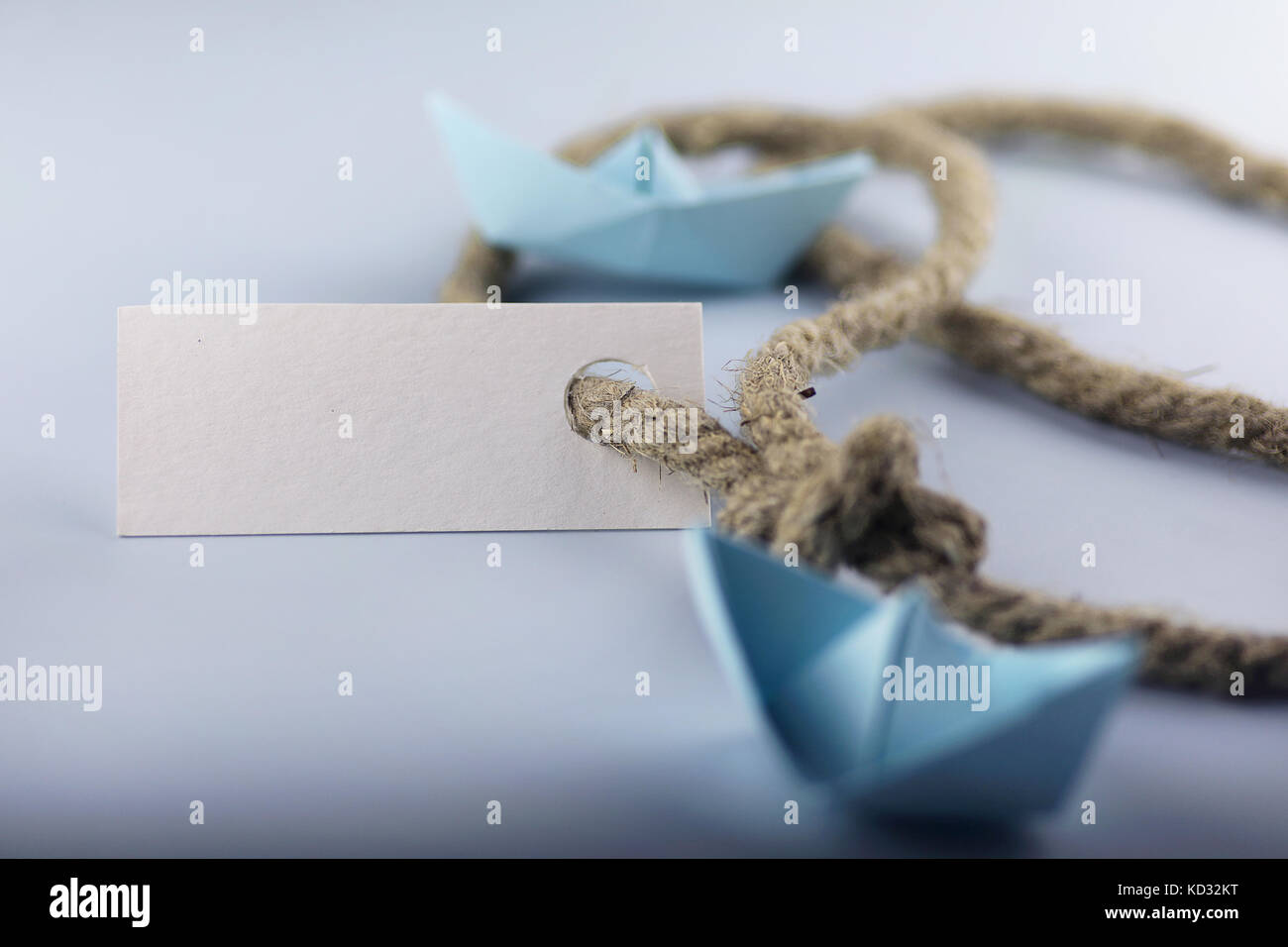 sticker with thick braided rope and ship paper origami Stock Photo - Alamy