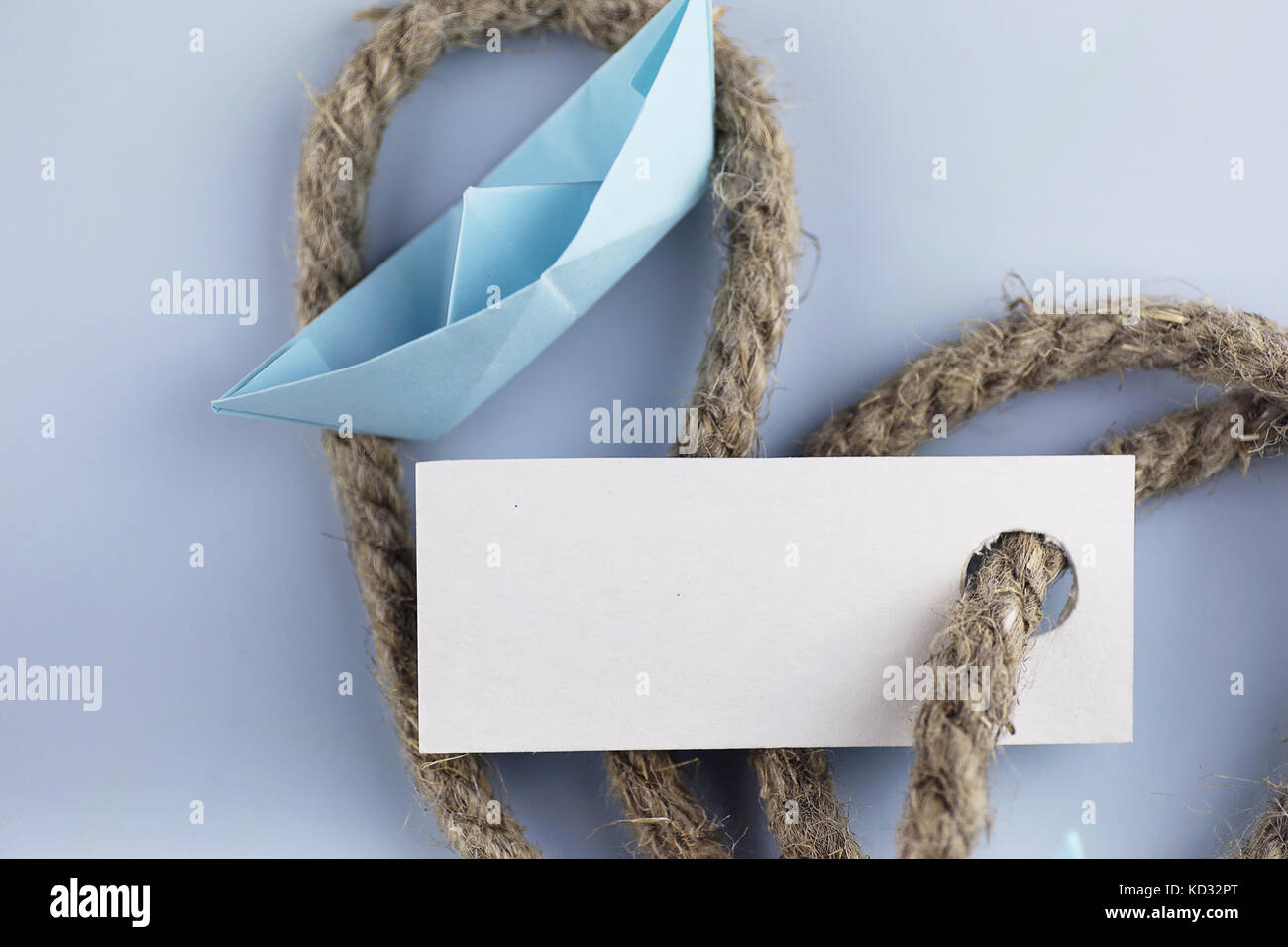 sticker with thick braided rope and ship paper origami Stock Photo - Alamy