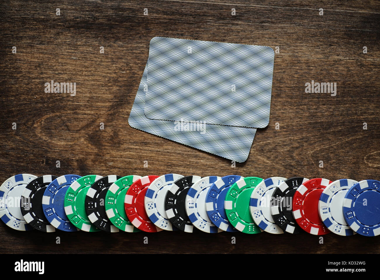 Playing chips and a deck of cards Stock Photo - Alamy