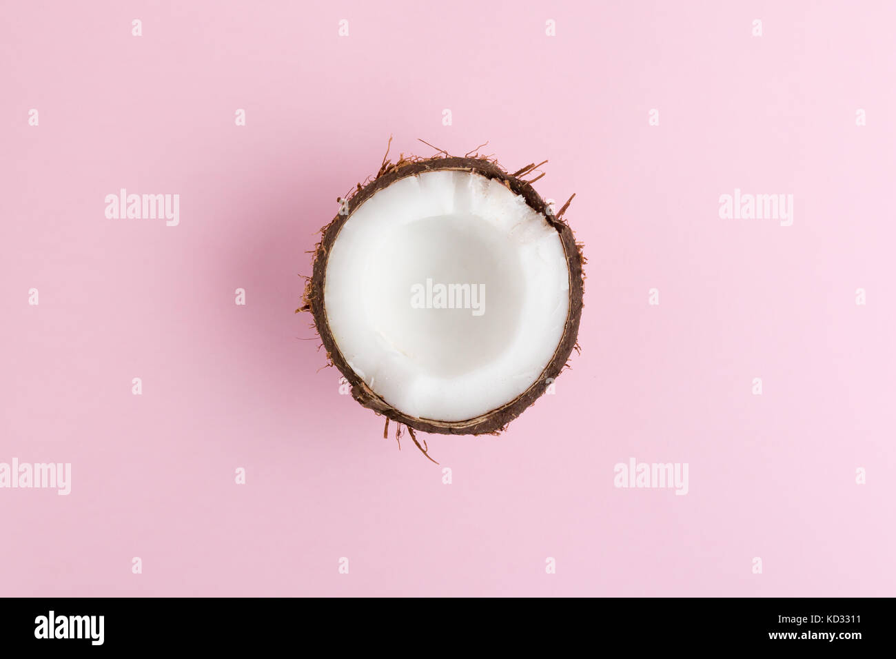 Styled stock minimalist photo of an isolated open coconut shell against ...