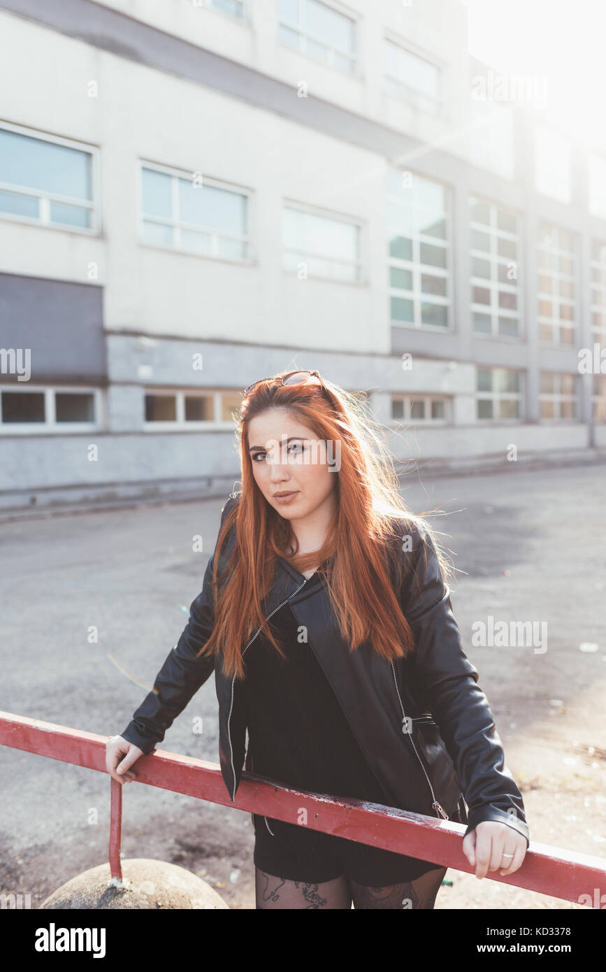 Female leaning against railing looking hi-res stock photography and ...