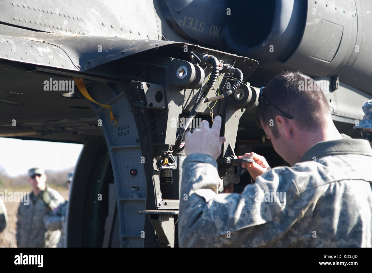U.S. Soldiers from the S.C. Army National Guard work to prepare a UH-60 ...