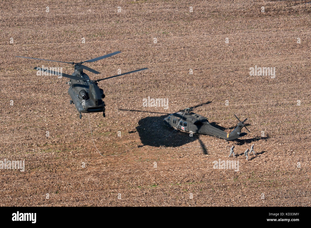 U.S. Soldiers from the S.C. Army National Guard work to prepare a UH-60 ...
