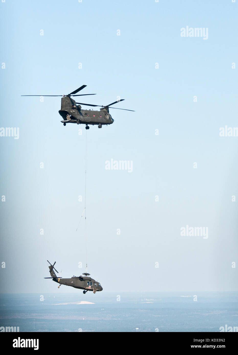 U.S. Soldiers from the S.C. Army National Guard sling load a UH-60 ...