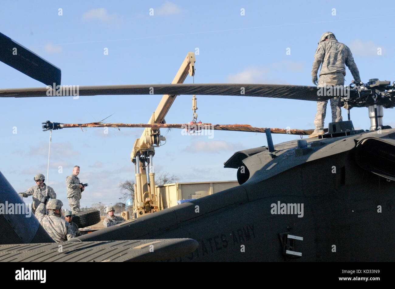 U.S. Soldiers from the S.C. Army National Guard work to prepare a UH-60 ...