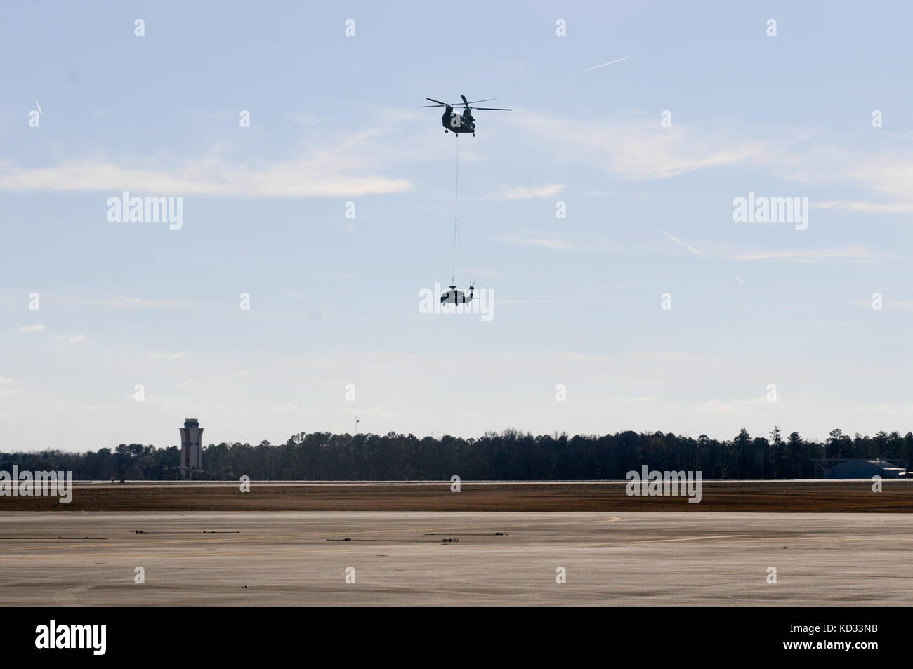 U.S. Soldiers from the S.C. Army National Guard sling load a UH-60 ...