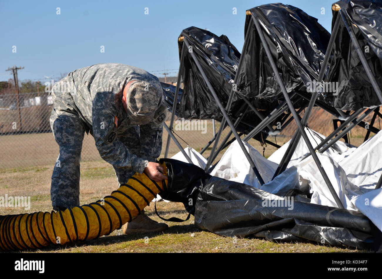 A blower system is attached to the Deployable Rapid Assembly Shelter to ...