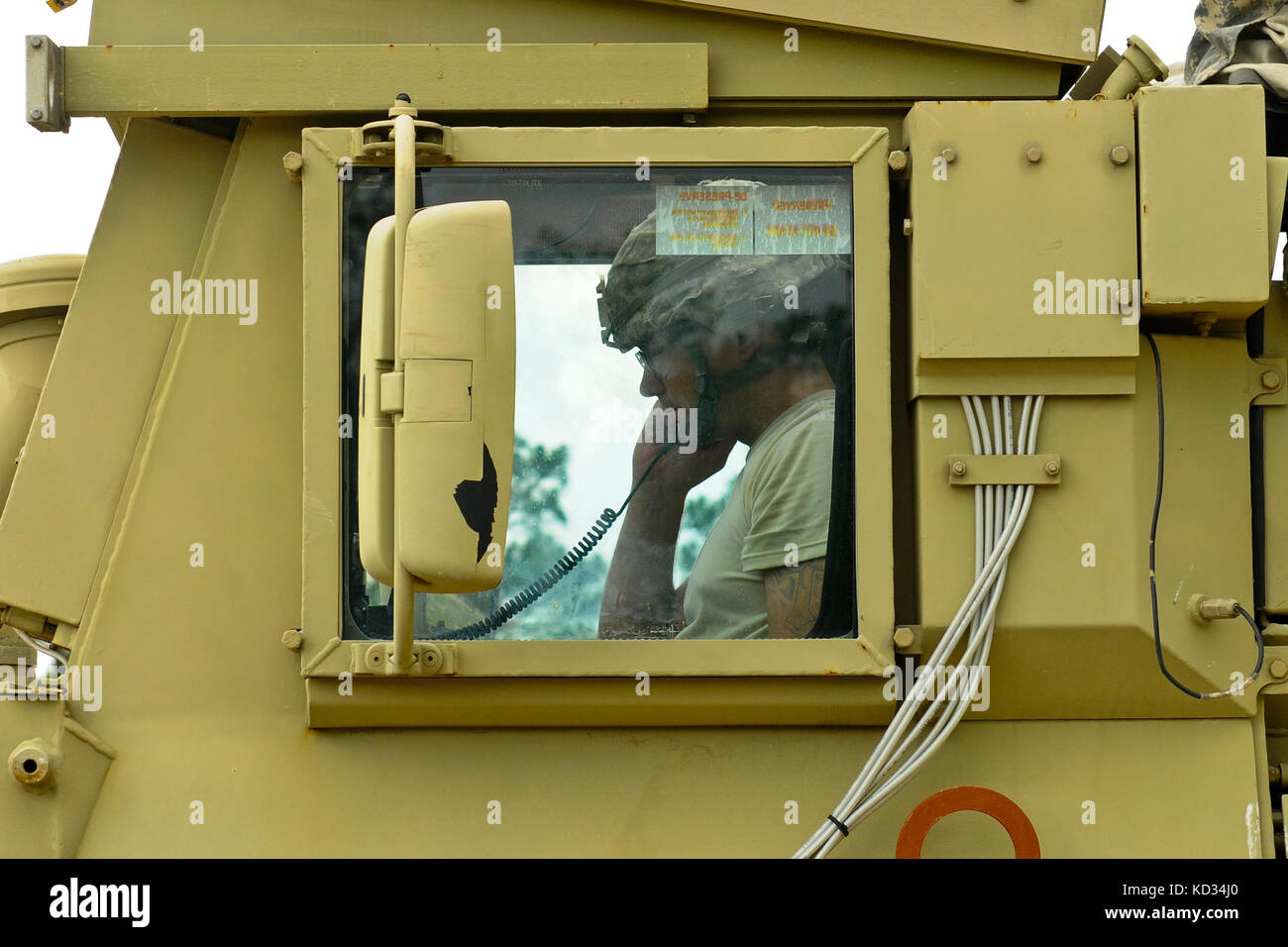 A U.S. Army Husky explosive device detection vehicle driver, assigned ...