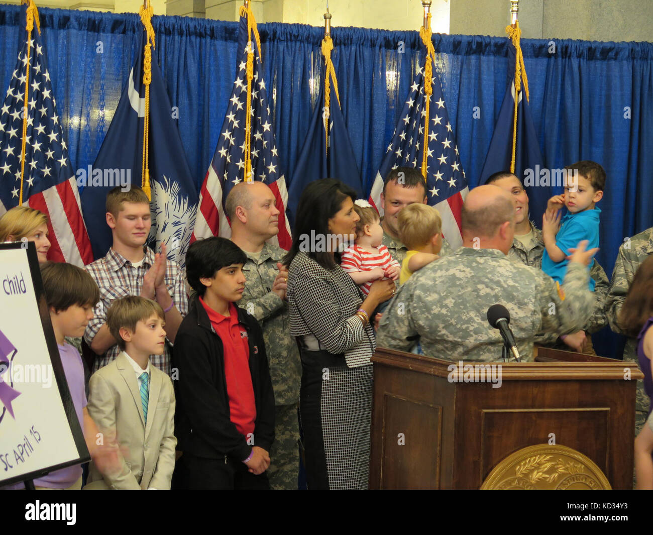 South Carolina Governor Nikki Haley holds a military child attending ...