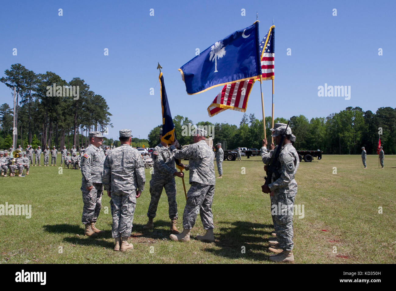The battalion colors are passed during a change of command ceremony for ...