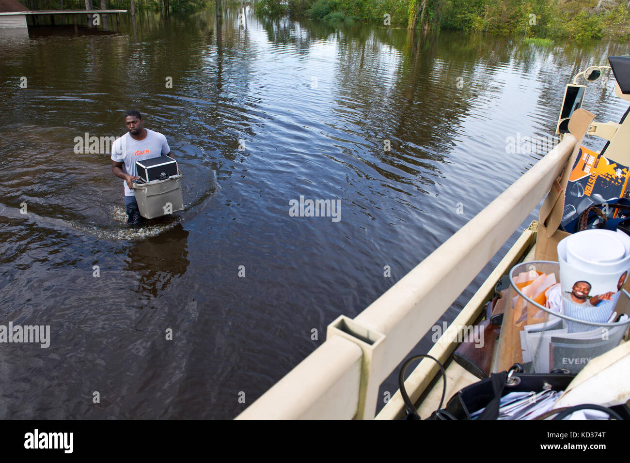Former NFL player Robert Geathers retrieves any possessions not ...