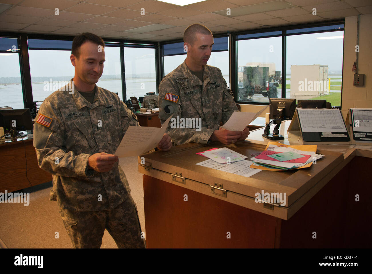 U.S. Soldiers with the South Carolina National Guard pause to read ...