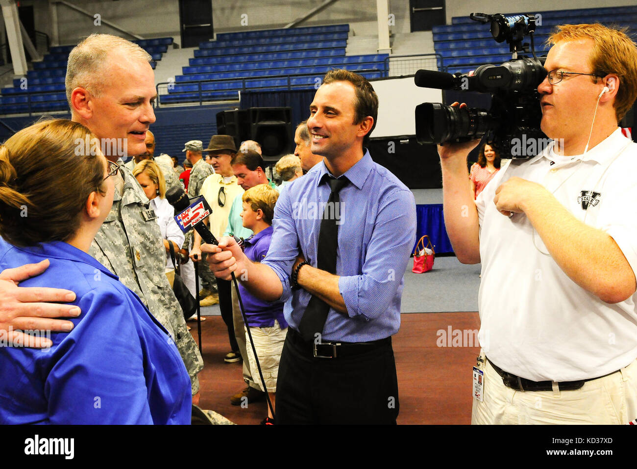 Maj. Barry Duncan and his wife Brandy, speak with a local reporter ...