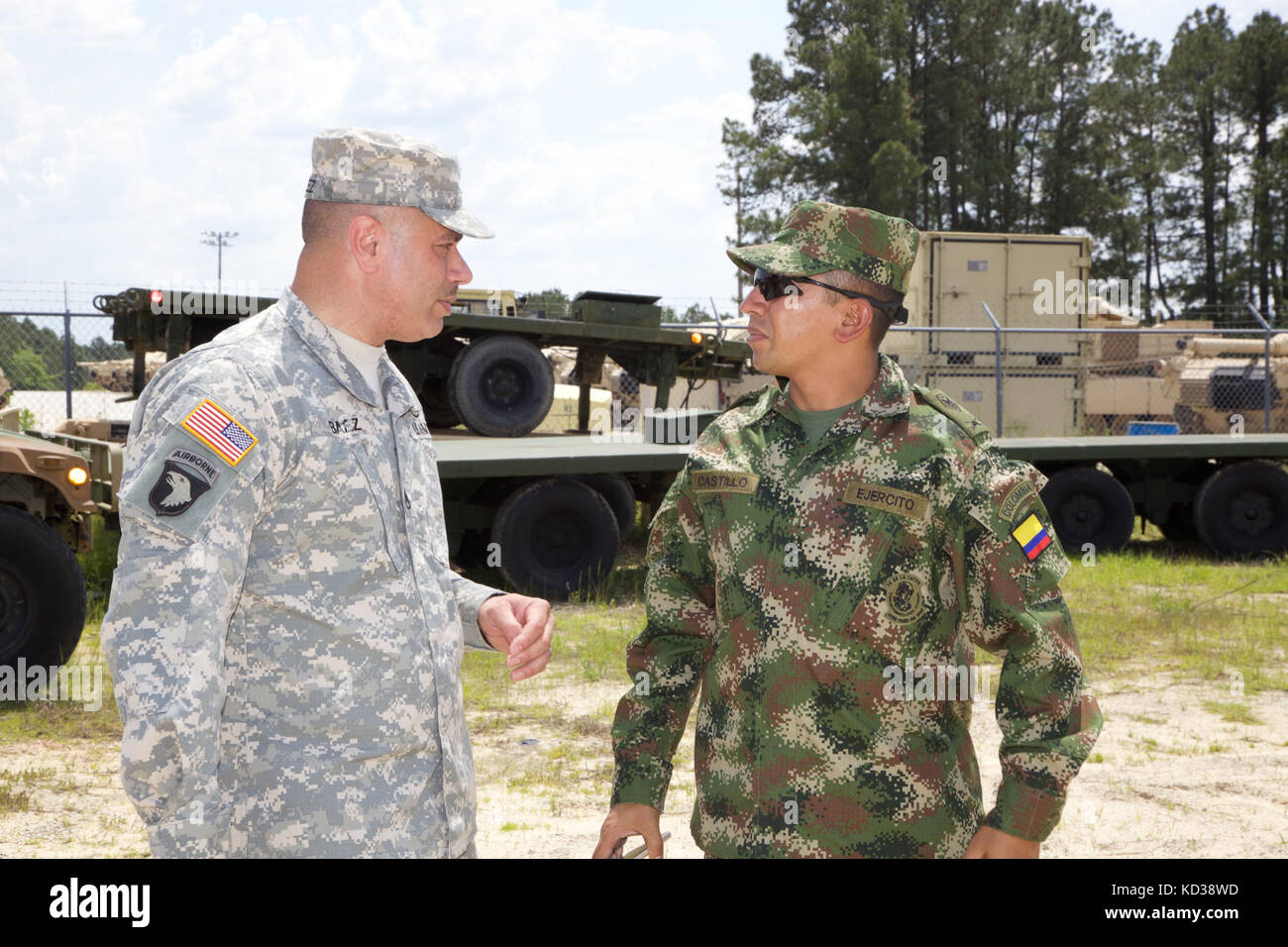 U.S. Army Staff Sgt. Luis Baez talks with Colombian Army Sgt. 1st Class ...
