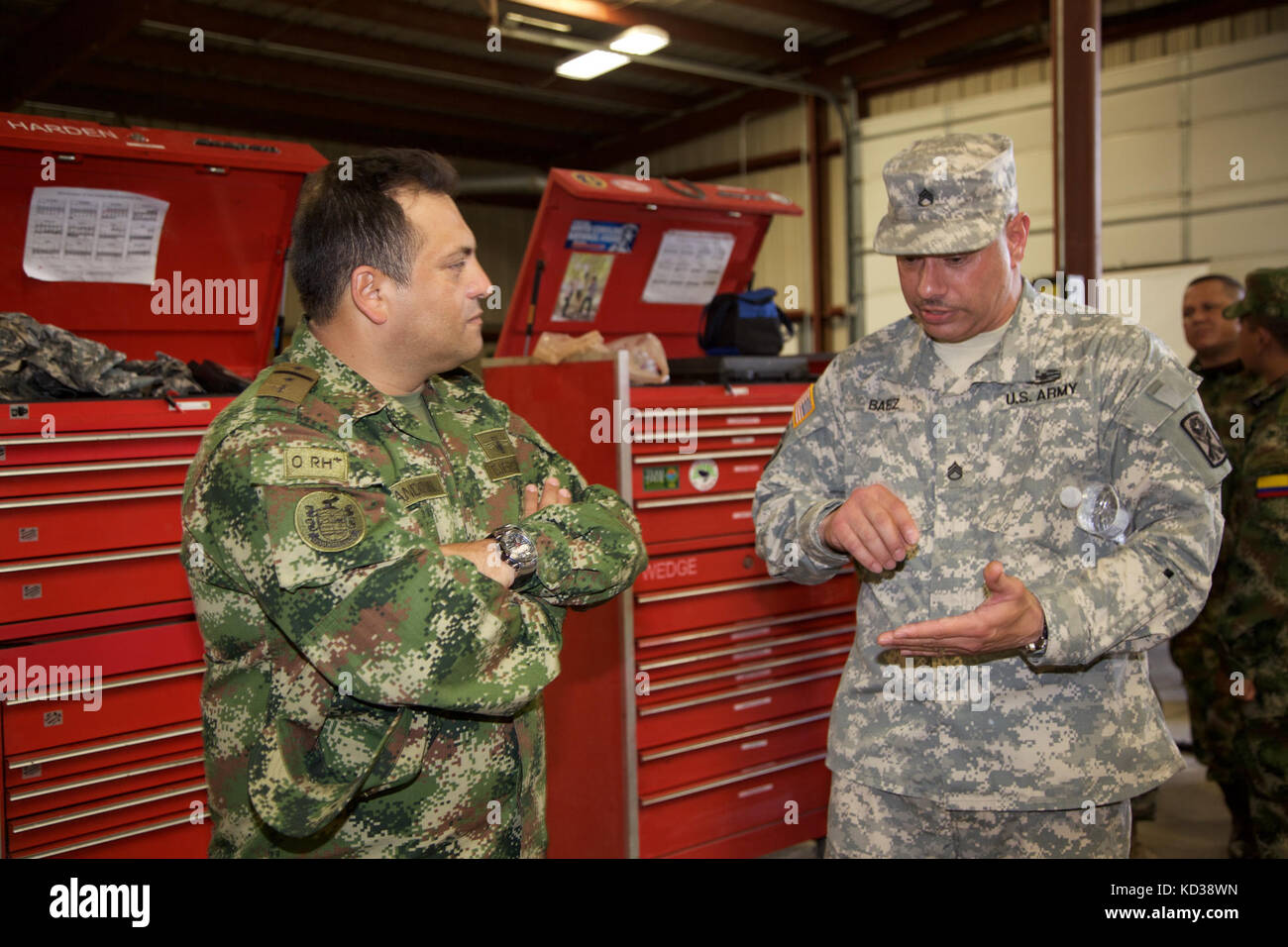 U.S. Army Staff Sgt. Luis Baez talks with Colombian Army Lt. Col ...