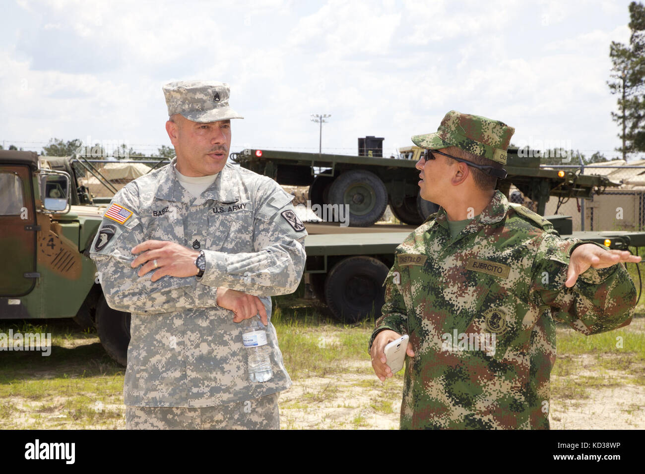 U.S. Army Staff Sgt. Luis Baez talks with Colombian Army Sgt. 1st Class ...