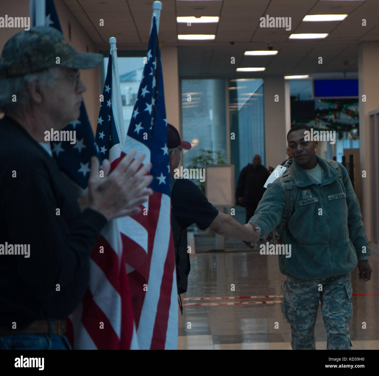 U.S. Army Sgt. Paul Garner is welcomed by Patriot Guard Riders and many ...