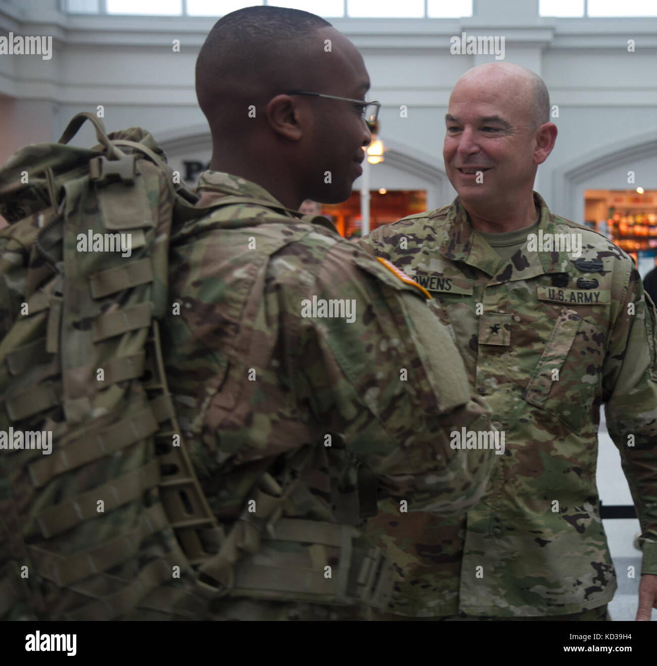 U.S. Army Sgt. Scott Lewis is welcomed by U.S. Army Brig. Gen. Brad ...