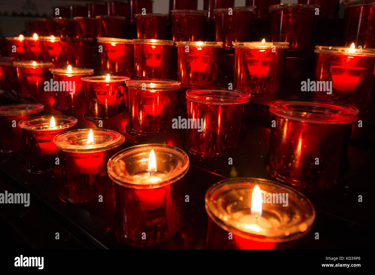 Row of red candles, typically inside of churches Stock Photo - Alamy