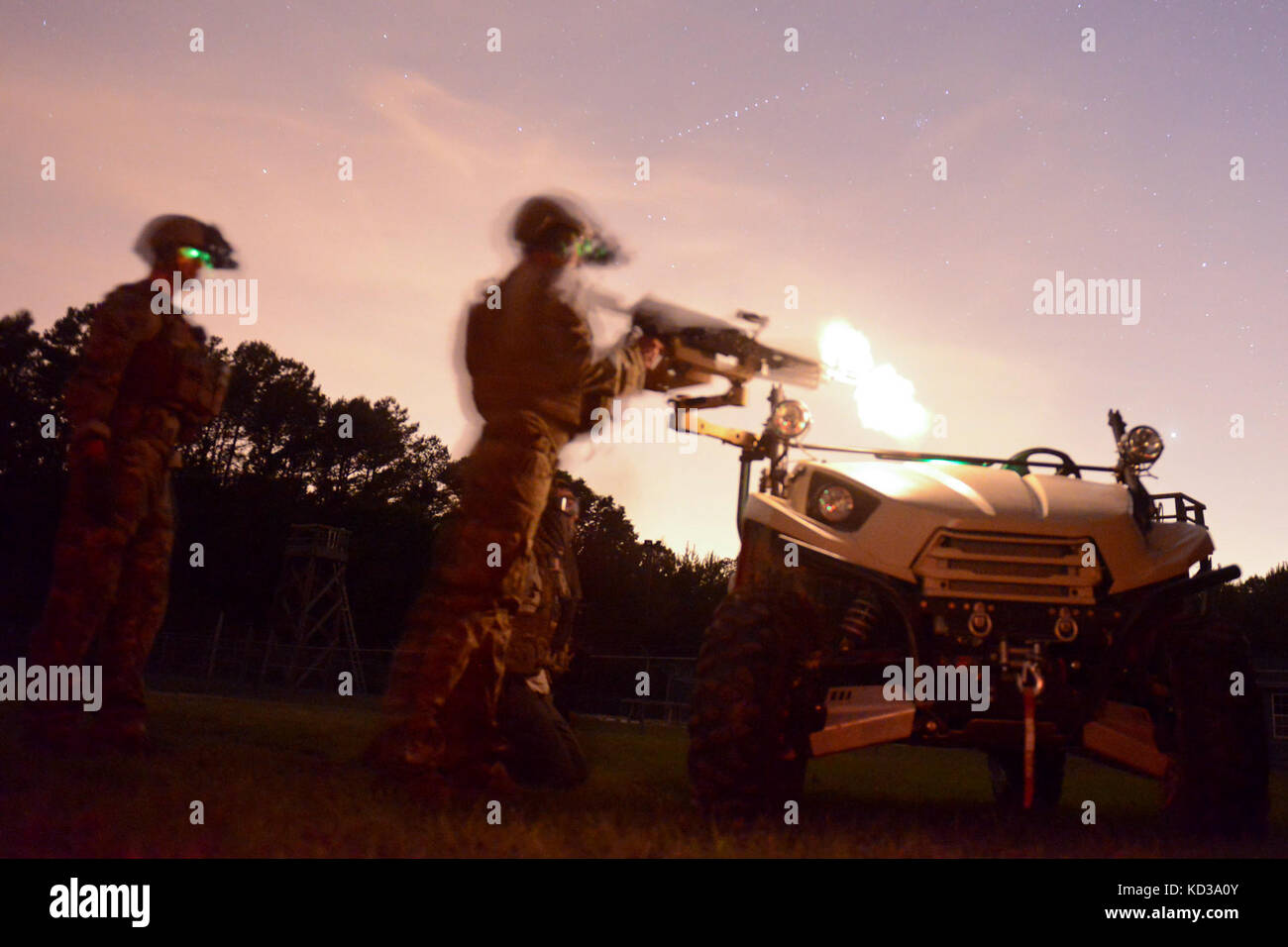 A U.S. Army Special Forces Soldier fires a M240 machine gun mounted on ...