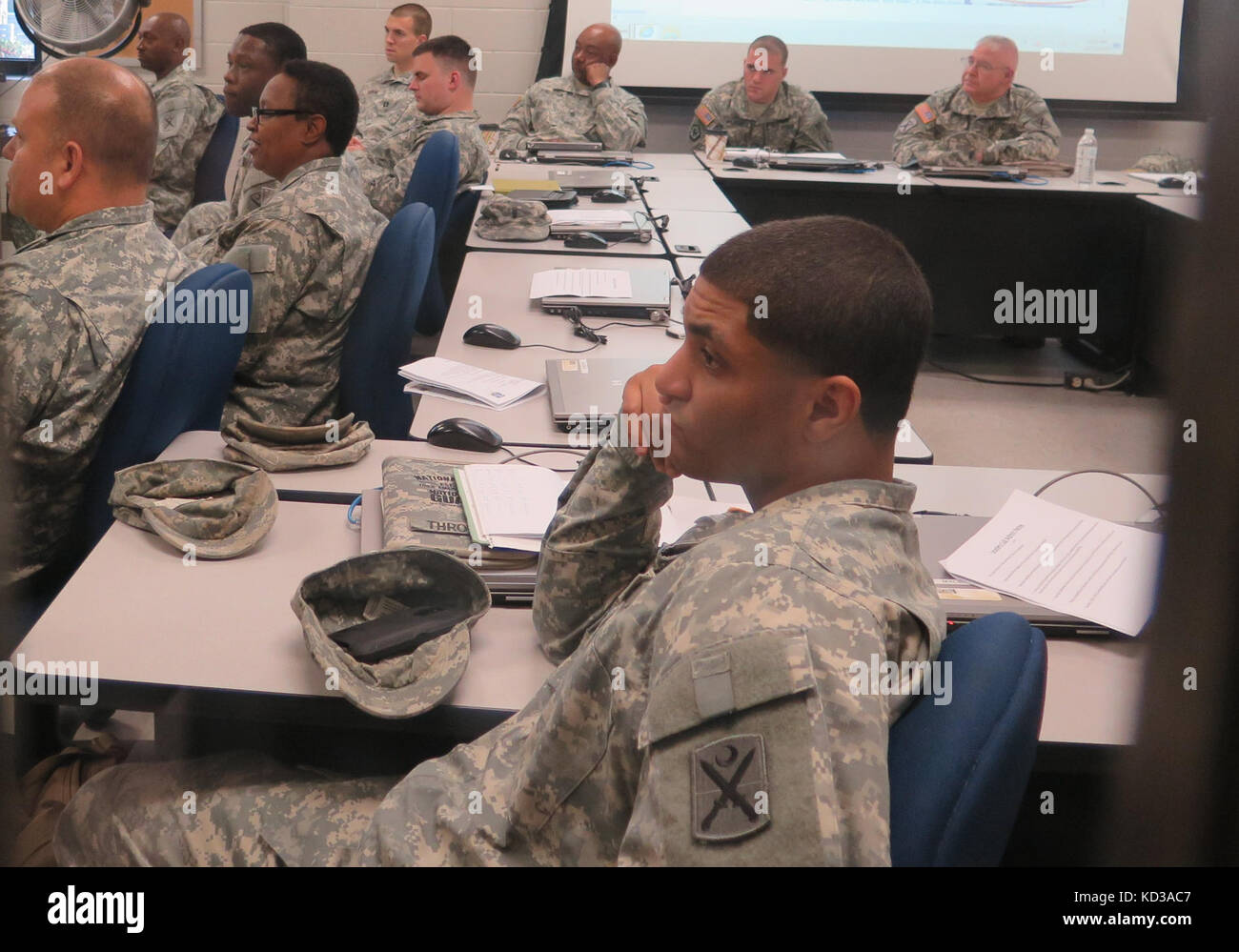 Leaders in the 218th Maneuver Enhancement Brigade listen to briefings ...