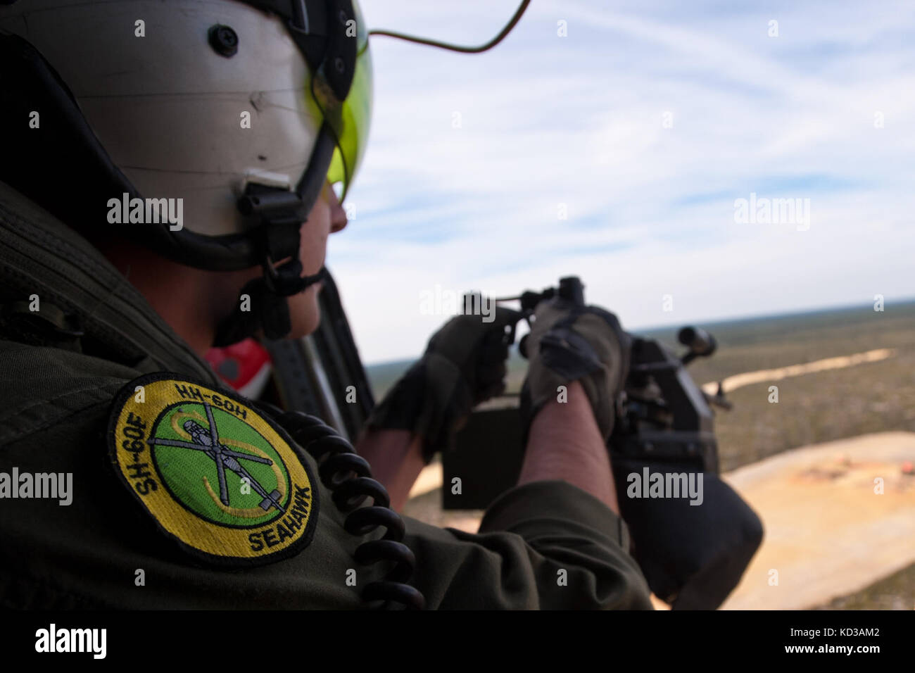 U.S. Navy Naval Air Crewman Mike Jones assigned to Helicopter Anti ...