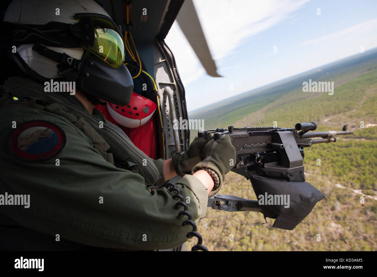 U.S. Navy Naval Air Crewman Daniel Mills assigned to Helicopter Anti ...