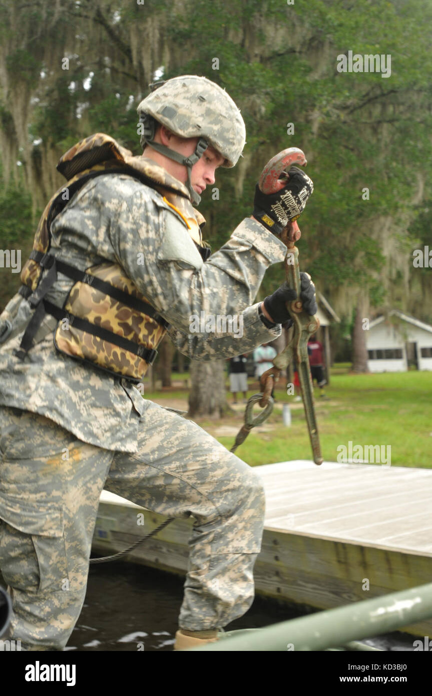 U.S. Army Spc. Eric Eaton, 125th Multi-Role Bridge Company, secures a ...