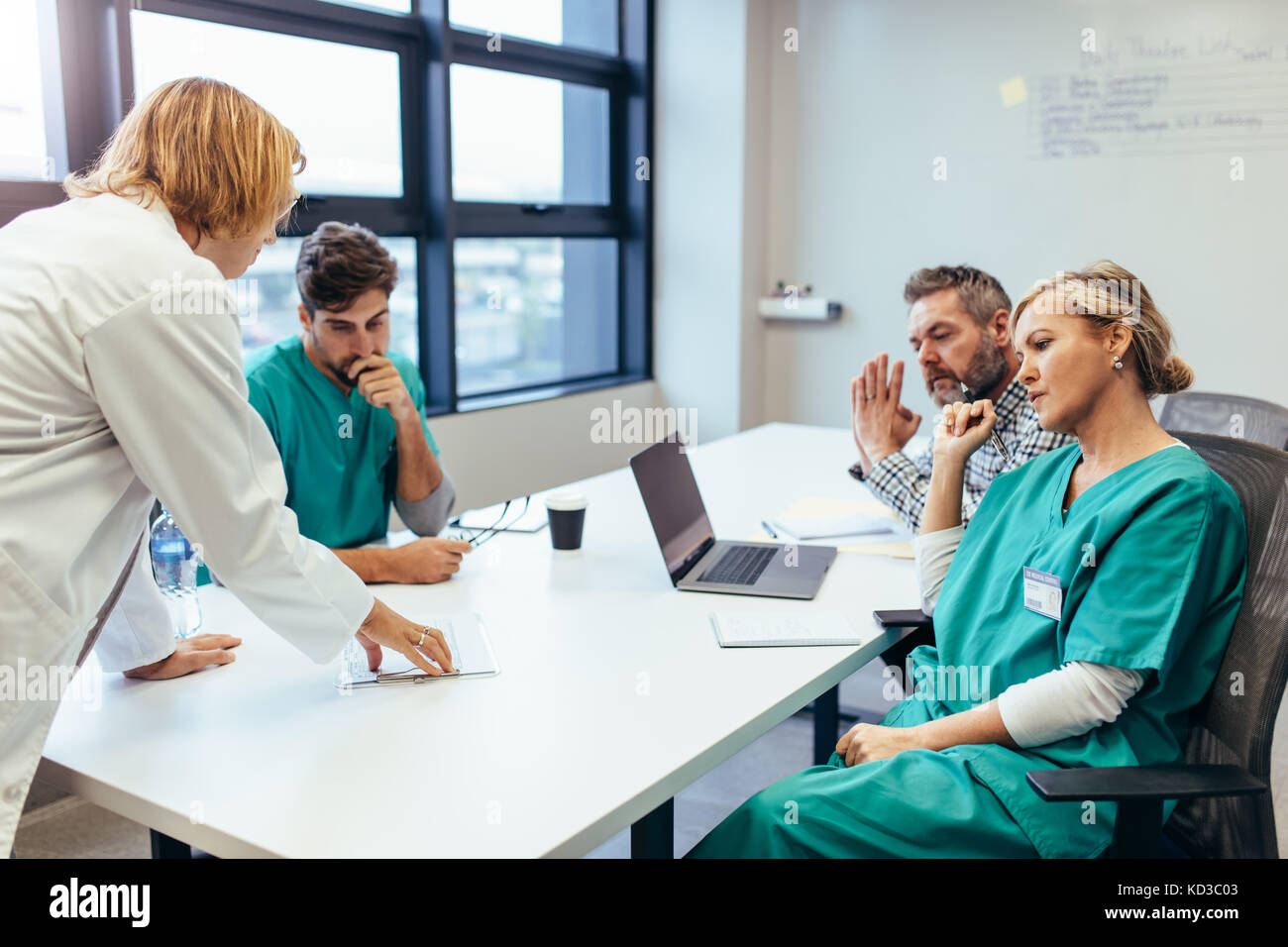 Group of medical professionals brainstorming in a meeting. Team of ...